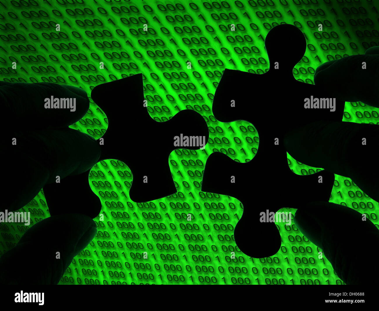 Two hands joining puzzle pieces, matrix Stock Photo - Alamy