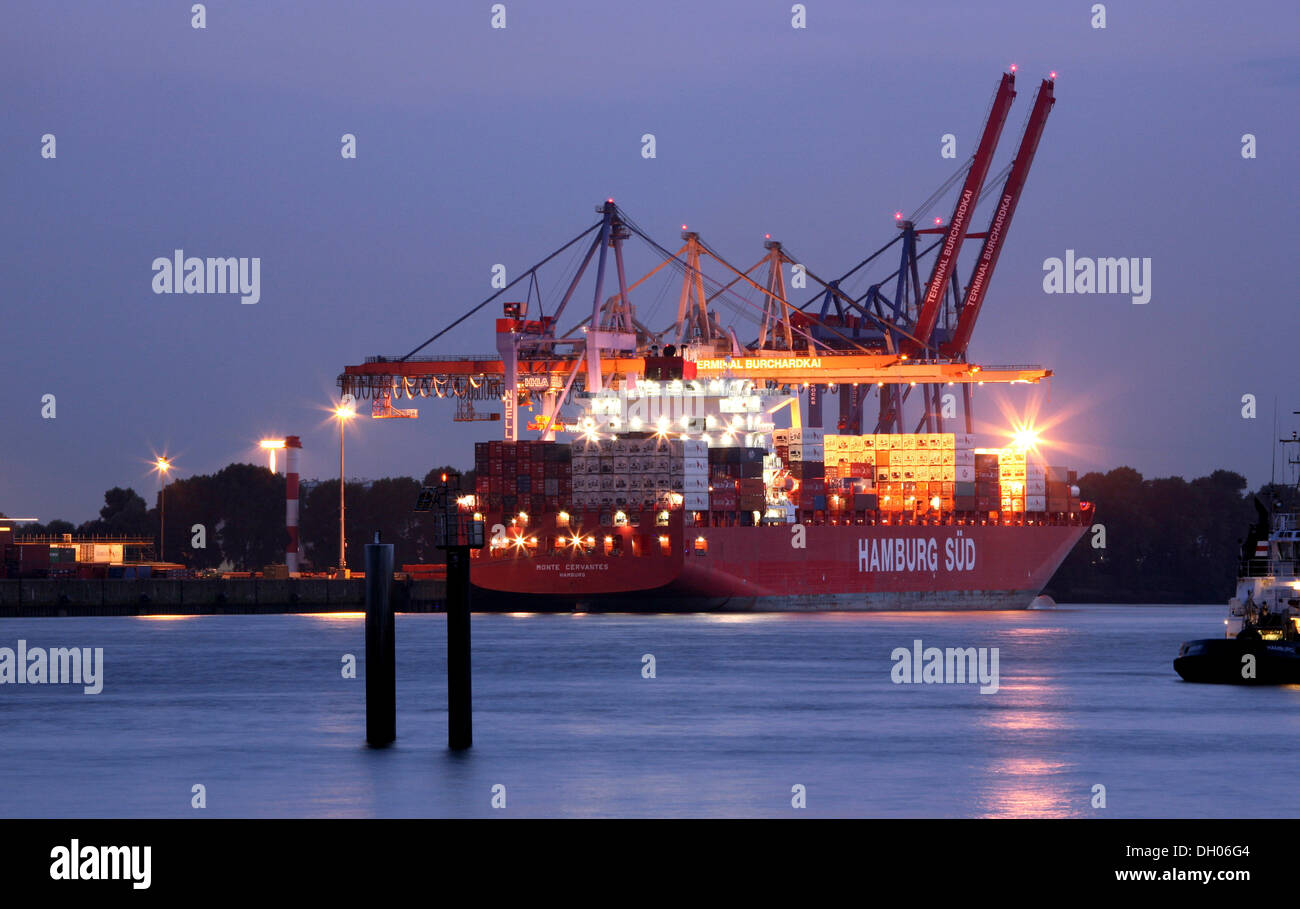 Containers being loaded on a ship in the port of Hamburg Stock Photo ...
