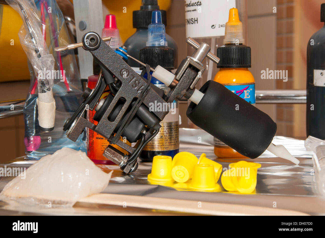 Workplace with a Micky Sharpz Model 007 Iron Hybrid tattoo machine and ...