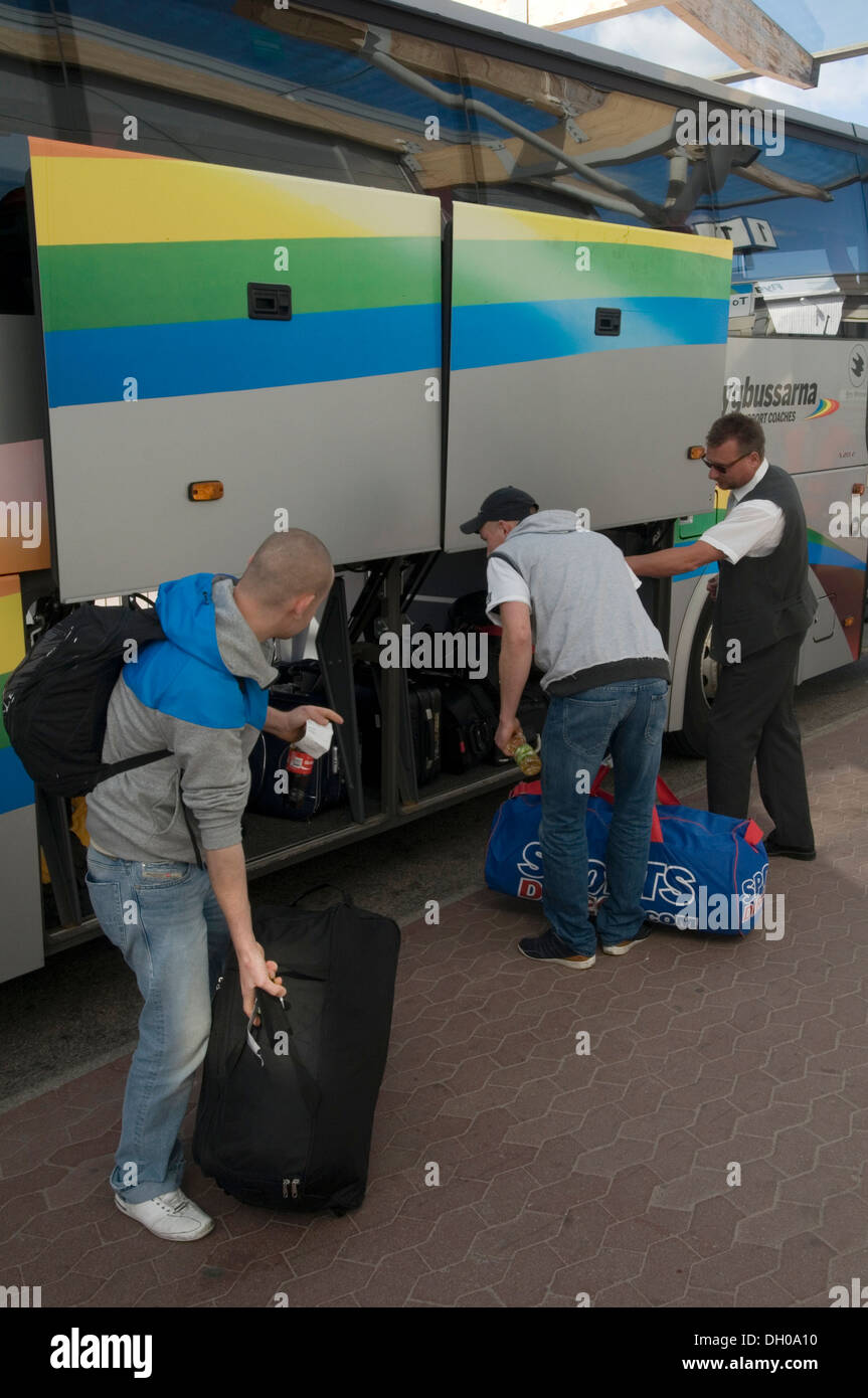 swebus sweden bus coach buses coaches luggage people loading bags ...