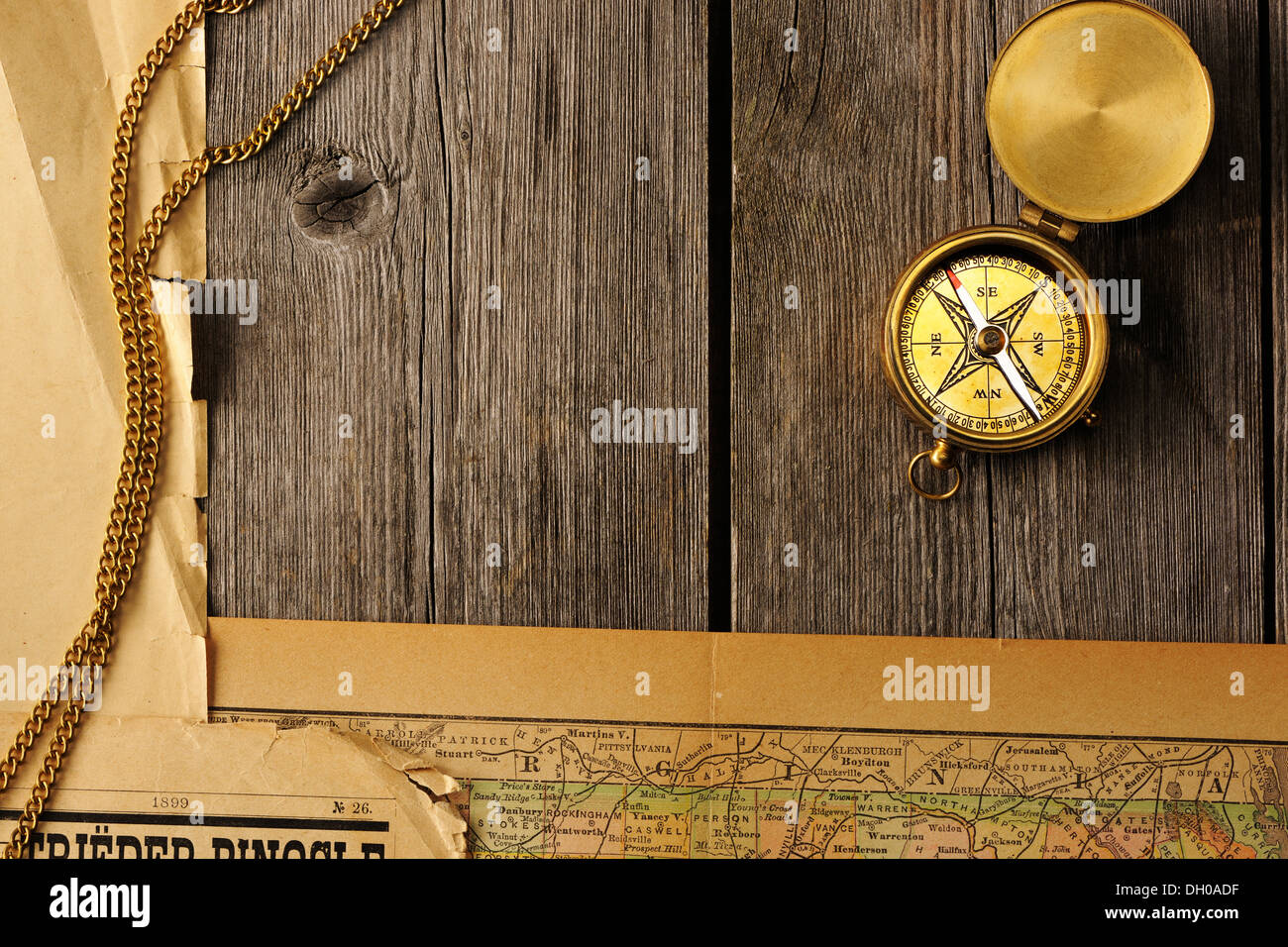 Antique compass over old map Stock Photo - Alamy