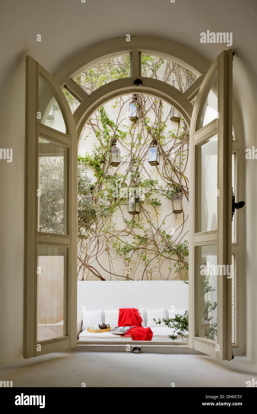 View through open window to internal Moroccan courtyard Stock Photo - Alamy