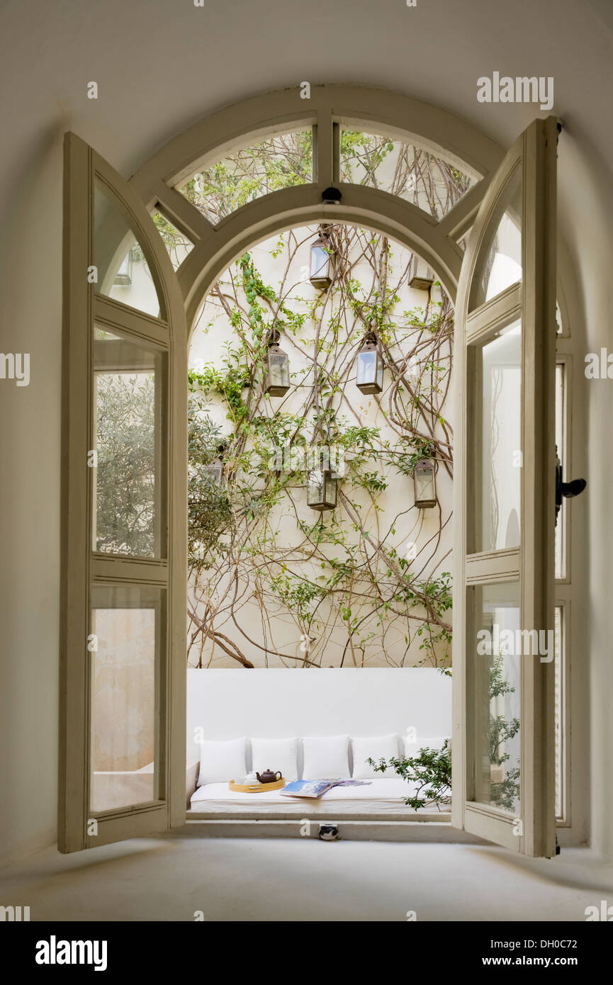 View through open window to internal Moroccan courtyard Stock Photo - Alamy