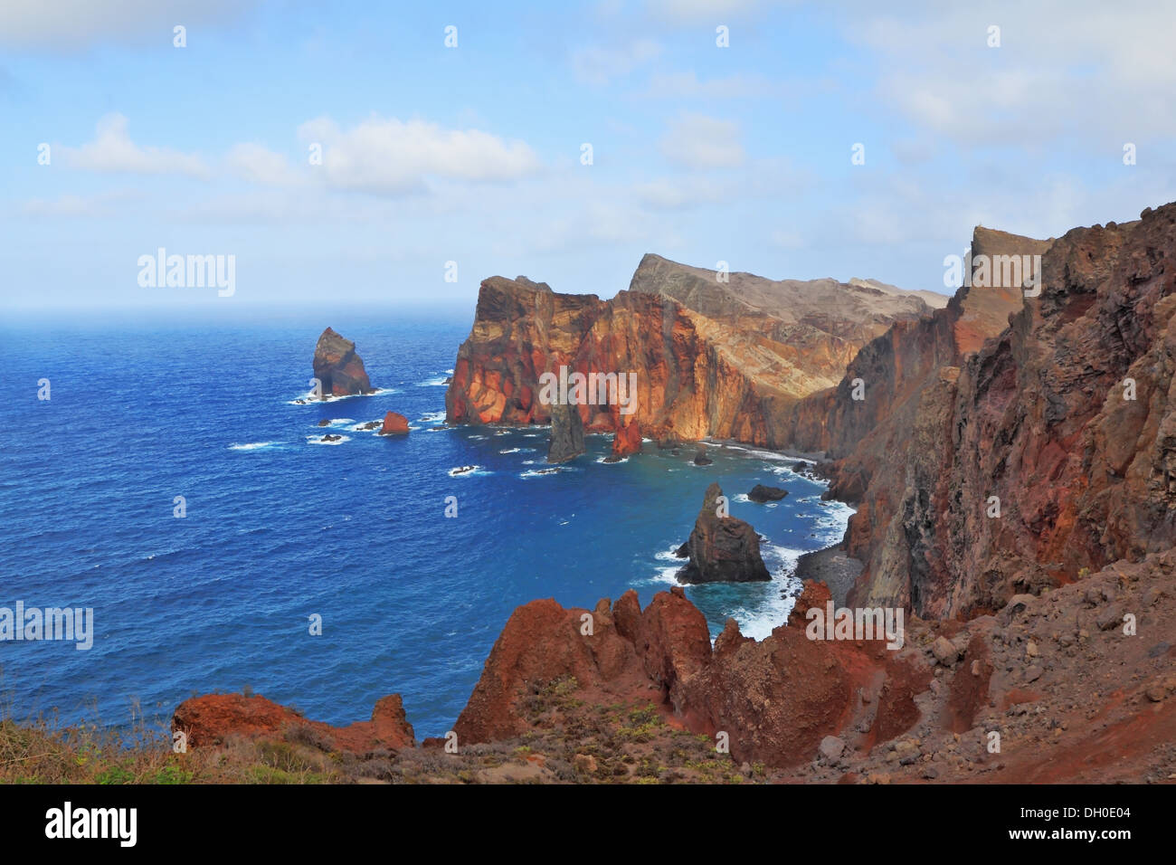 Red rocks and blue sea Stock Photo - Alamy