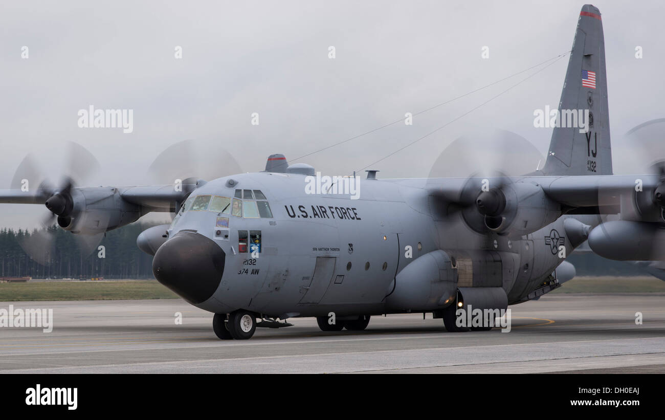 Col. Mark August, 374th Airlift Wing commander, taxis to the front of a ...