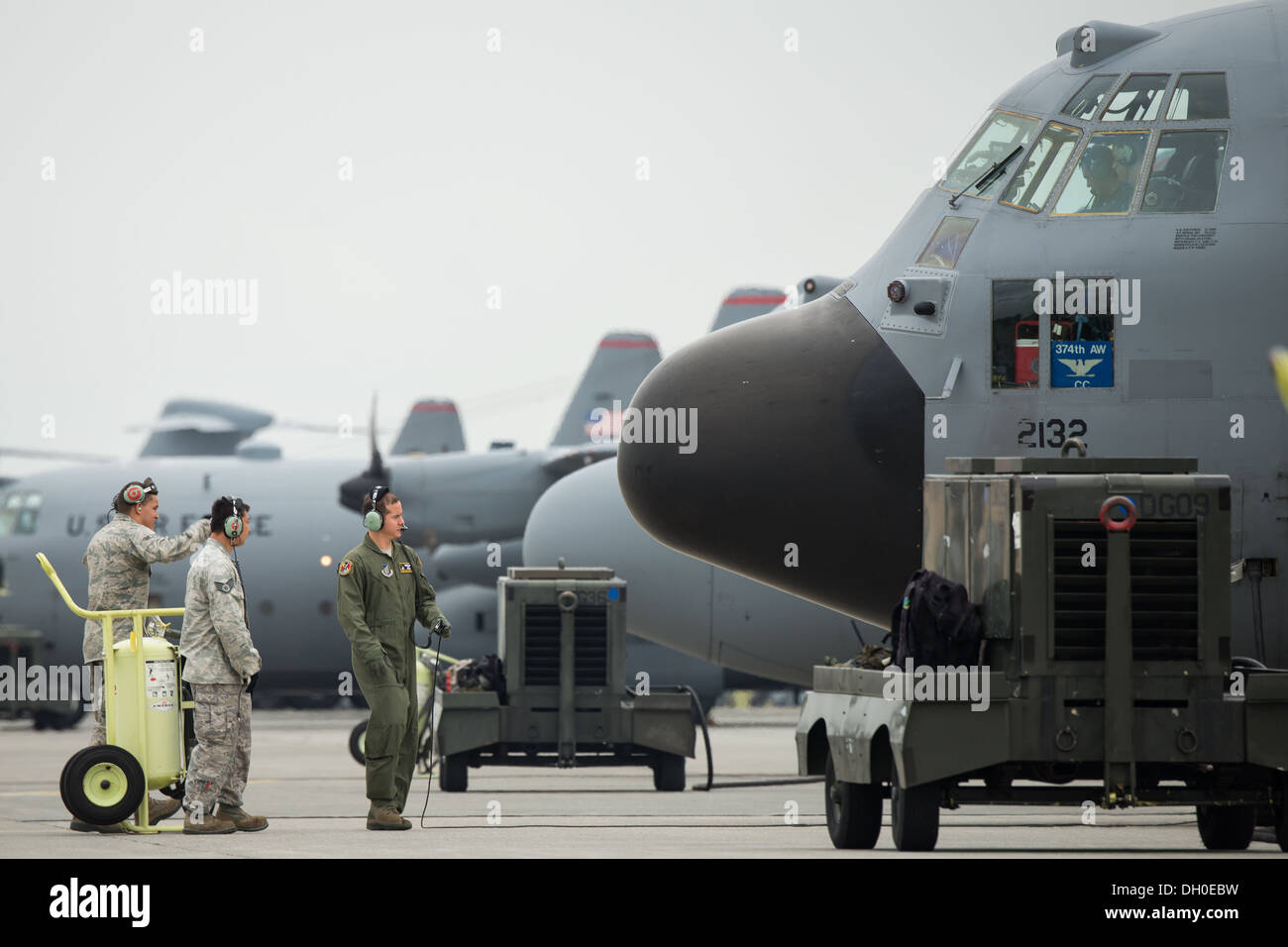 Airmen perform preflight inspection by c 130 hercules at air base hi ...