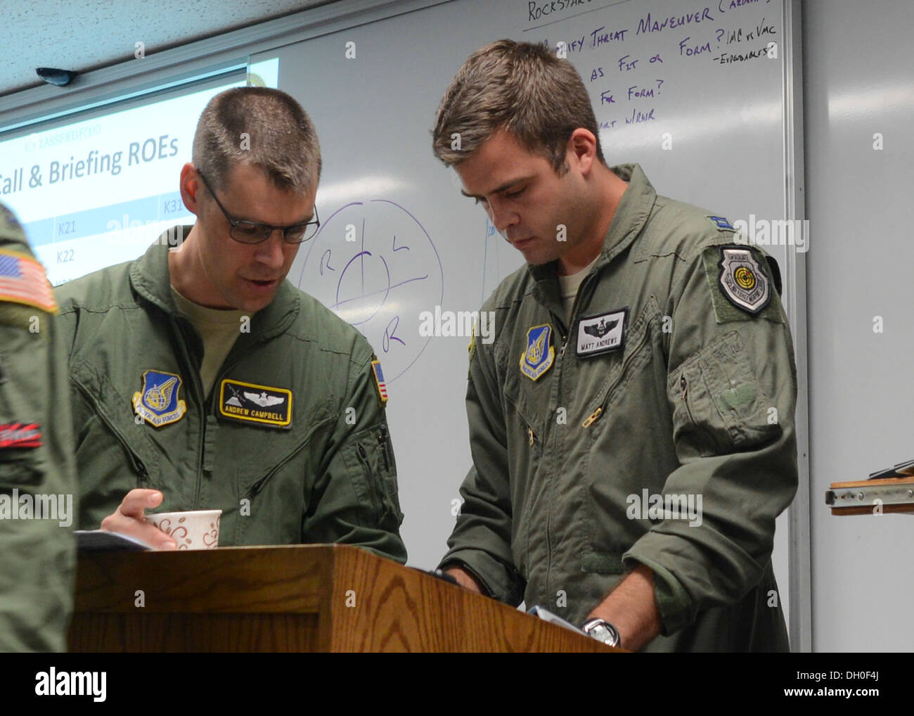 Lt. Col. Andrew Campbell, the director of operations, and Capt. Matthew ...