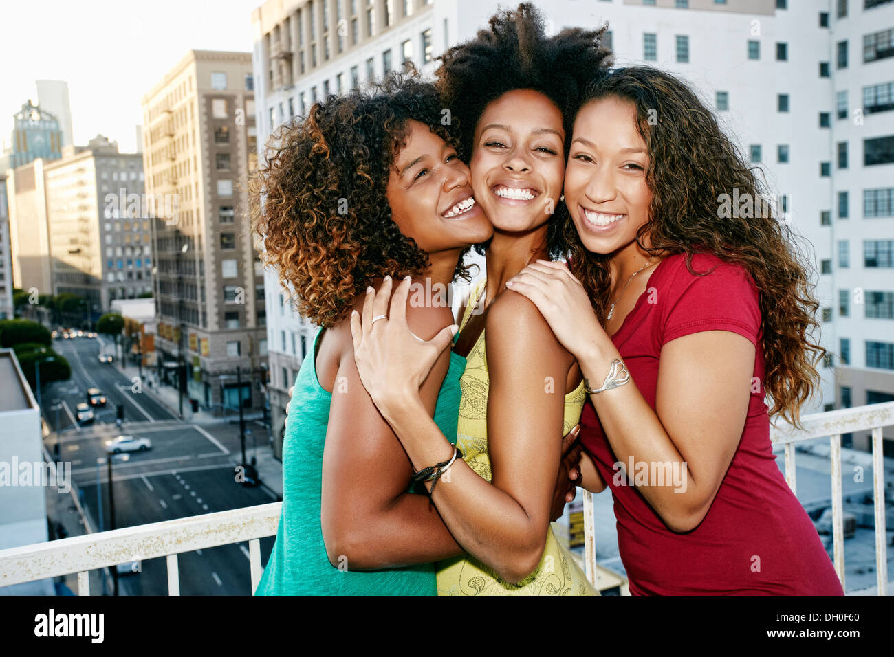 Mixed race women on urban rooftop Stock Photo - Alamy