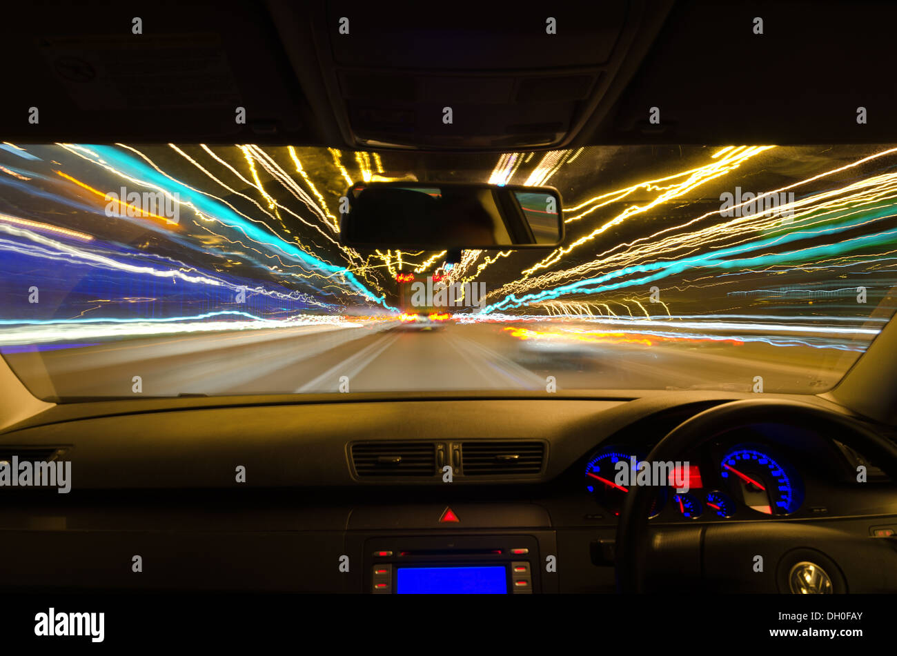 view through the windscreen of a moving car with motion blur and ...
