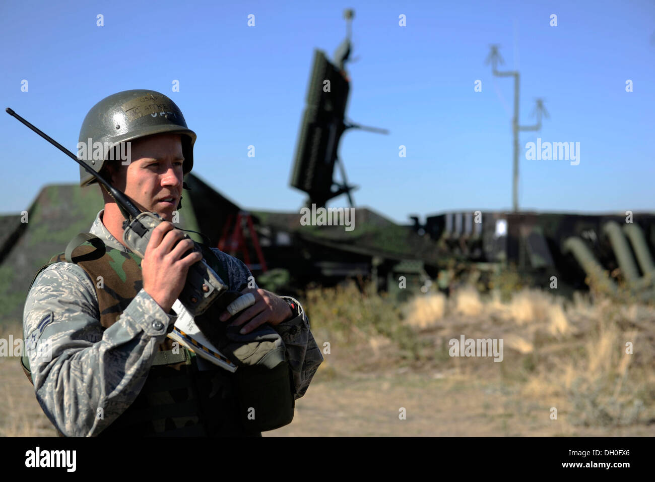 U.S. Air Force Airman 1st Class Austin Aitkin radios to the command ...
