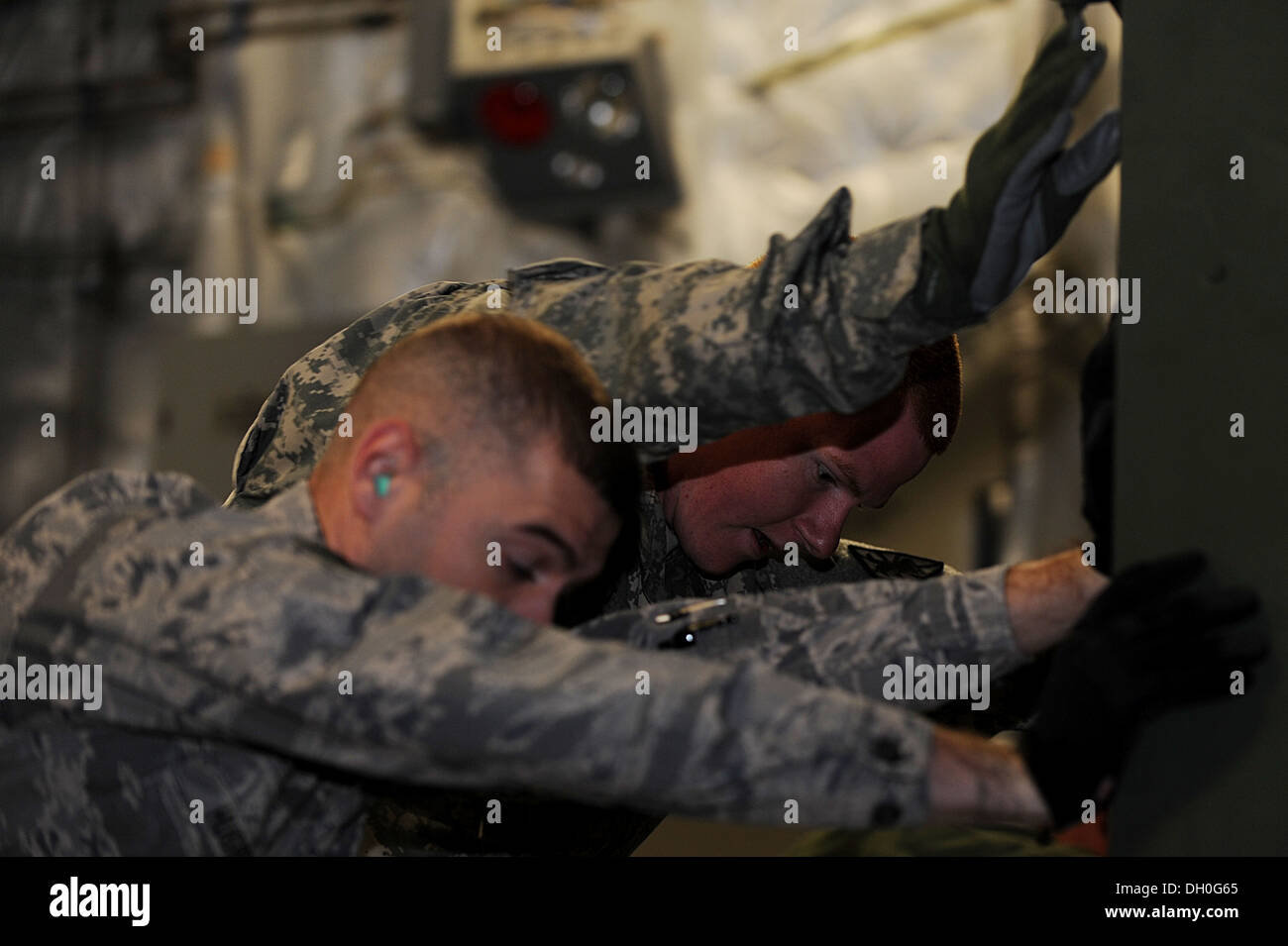 U.S. Air Force Staff Sgt. Andrew Hughes, left, 633rd Logistics ...