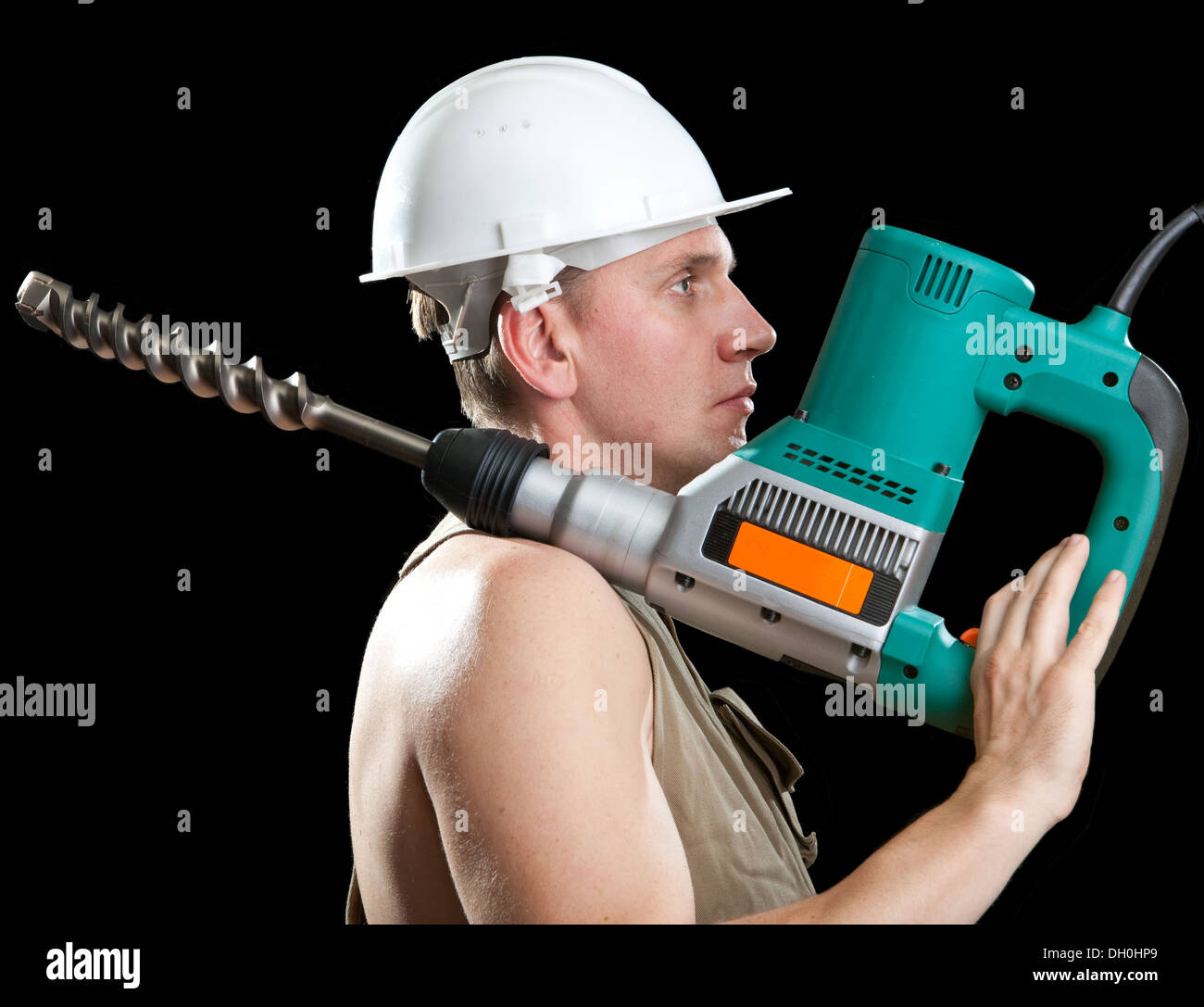 The builder in a protective helmet holds Stock Photo - Alamy