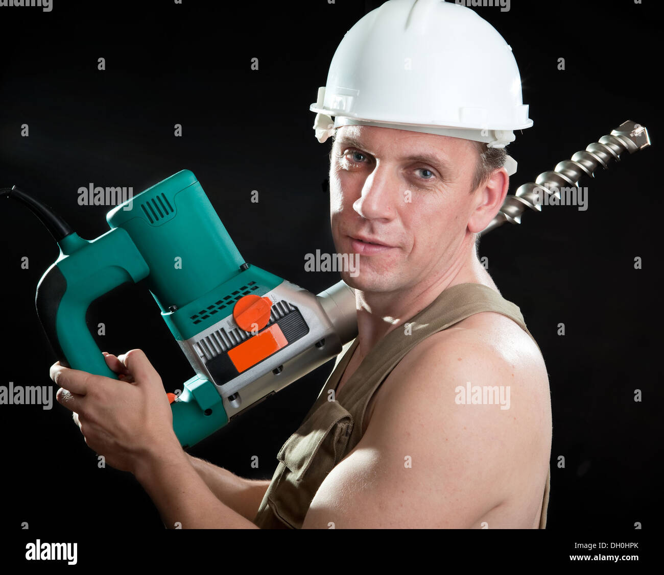 Construction industry worker holds helmet hi-res stock photography and ...