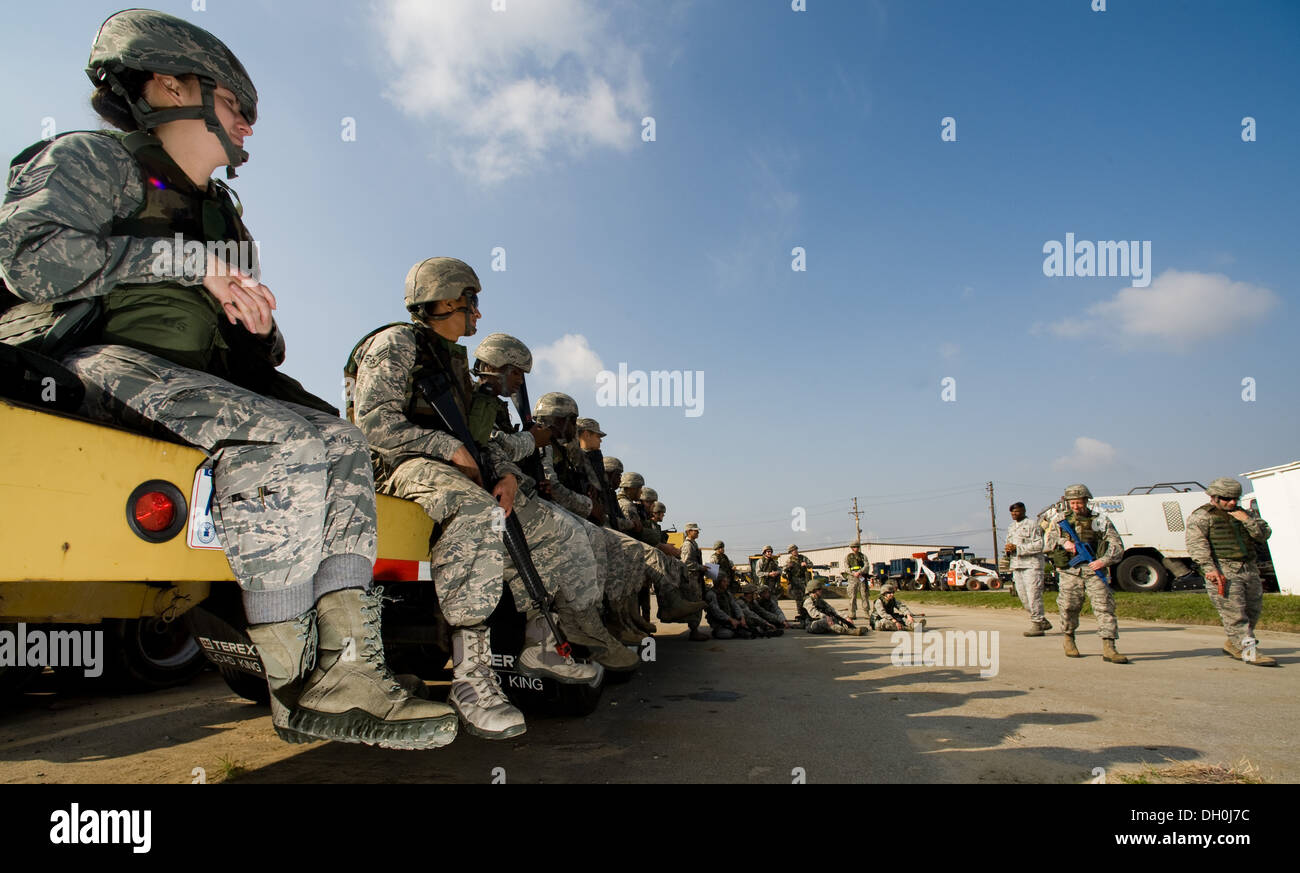 Airmen from the 8th Civil Engineer Squadron Red Devils listen to a ...