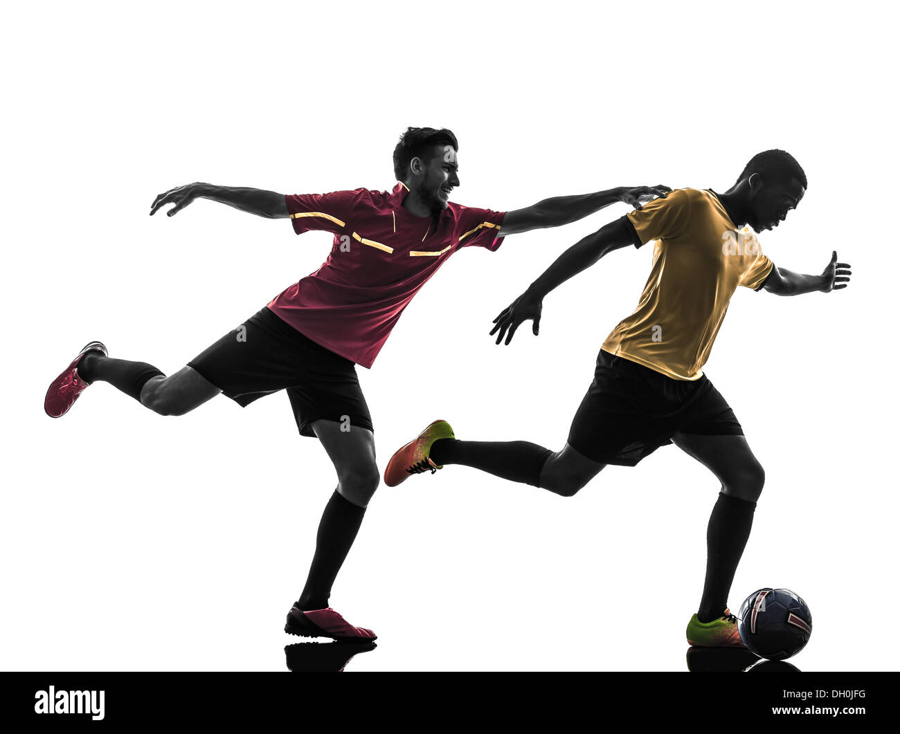 two men soccer player playing football competition in silhouette on ...
