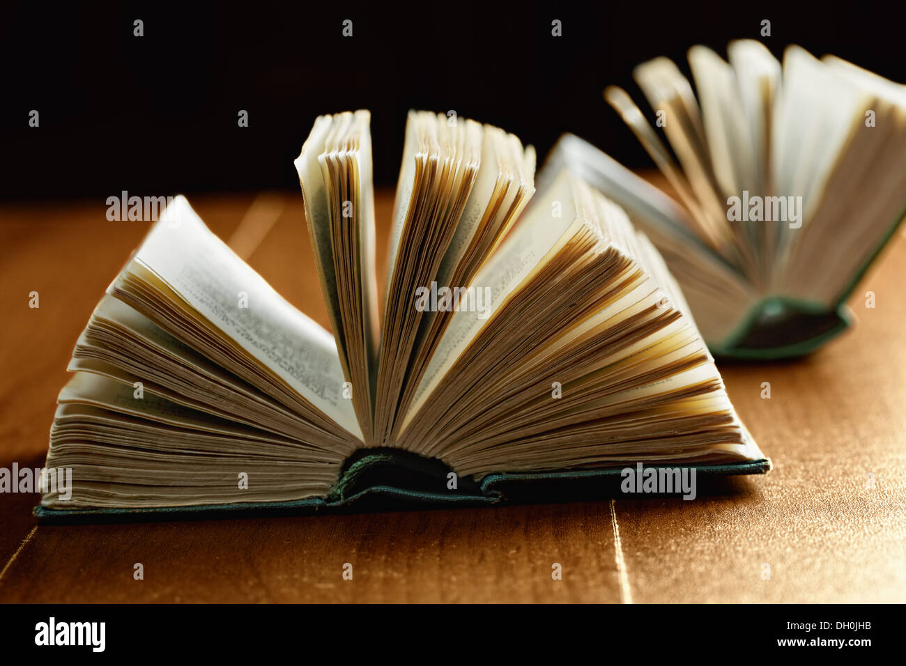 Two open old books Stock Photo - Alamy