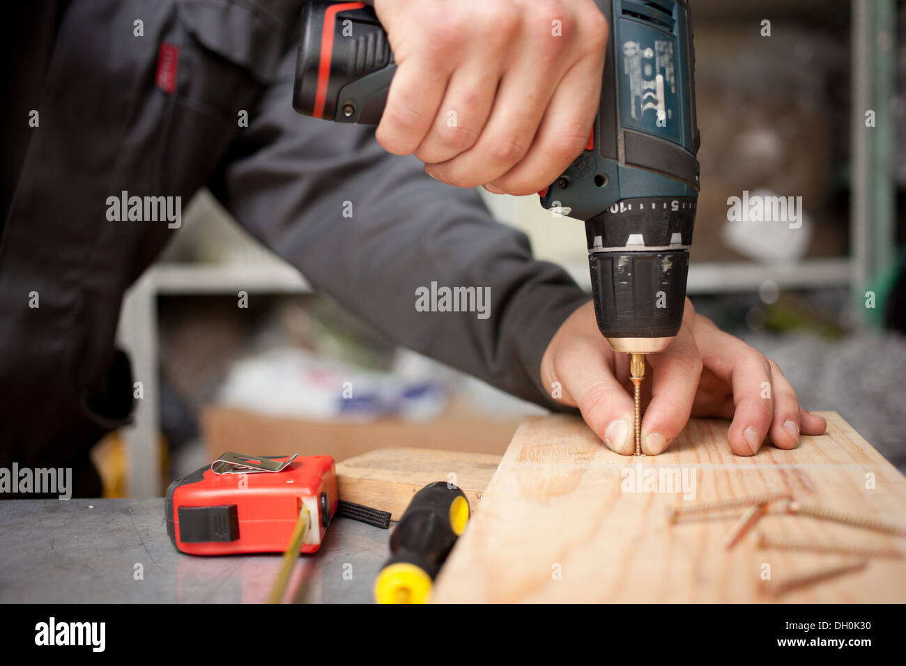 Man with screwdriver Stock Photo - Alamy