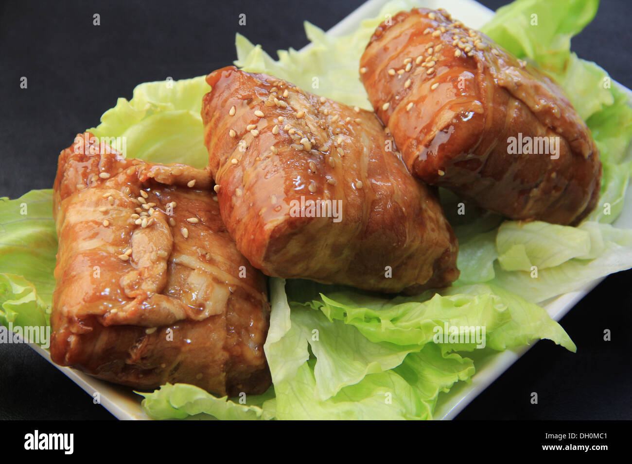 Rice balls wrapped in sliced meat Stock Photo - Alamy