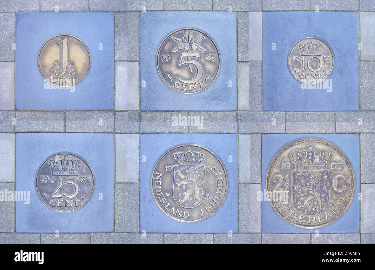 Collection of former Dutch coins cemented in sidewalk, fit in a frame ...