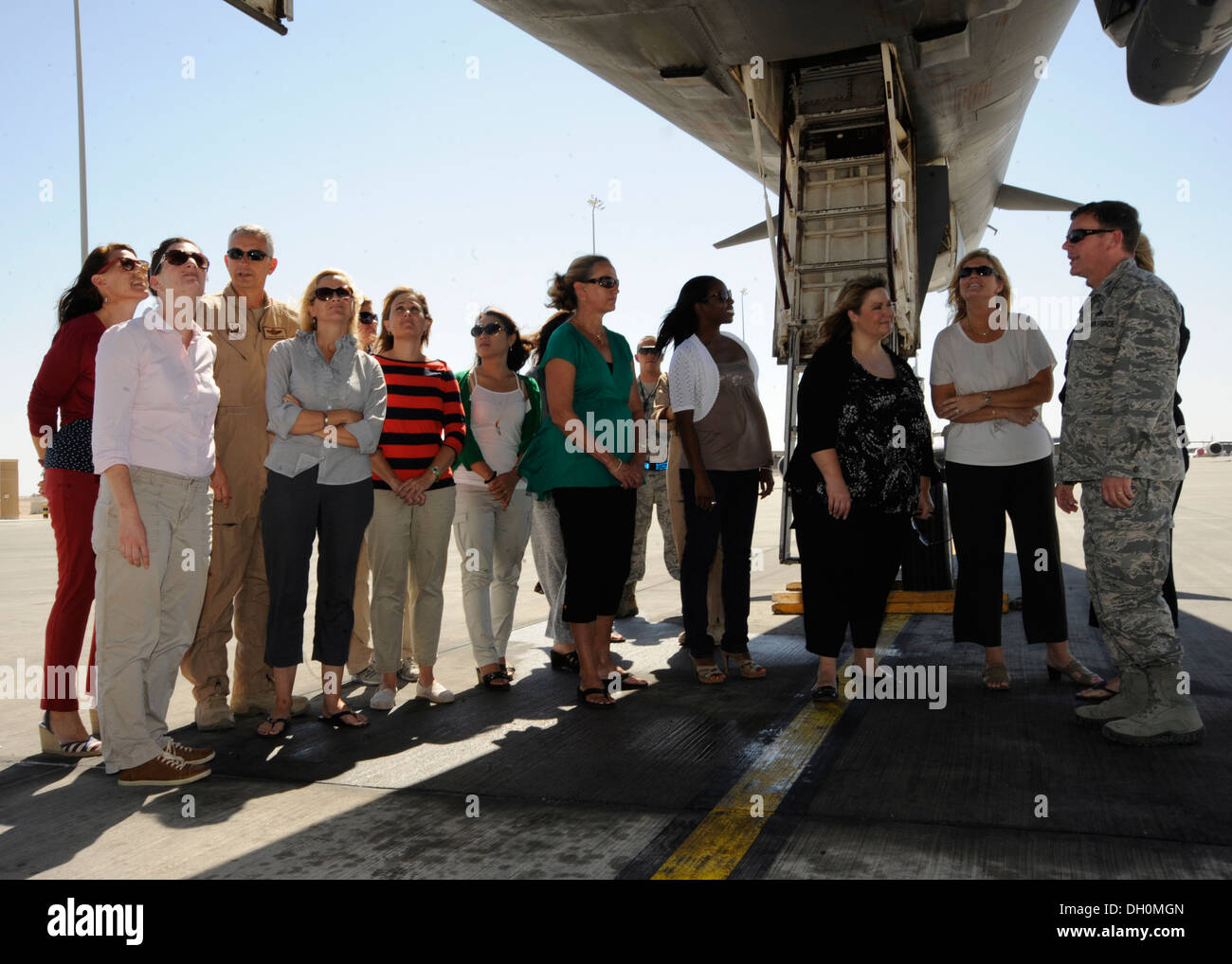 Col. Bryan Harris shows military spouses the bomb carriage on a B-1B ...