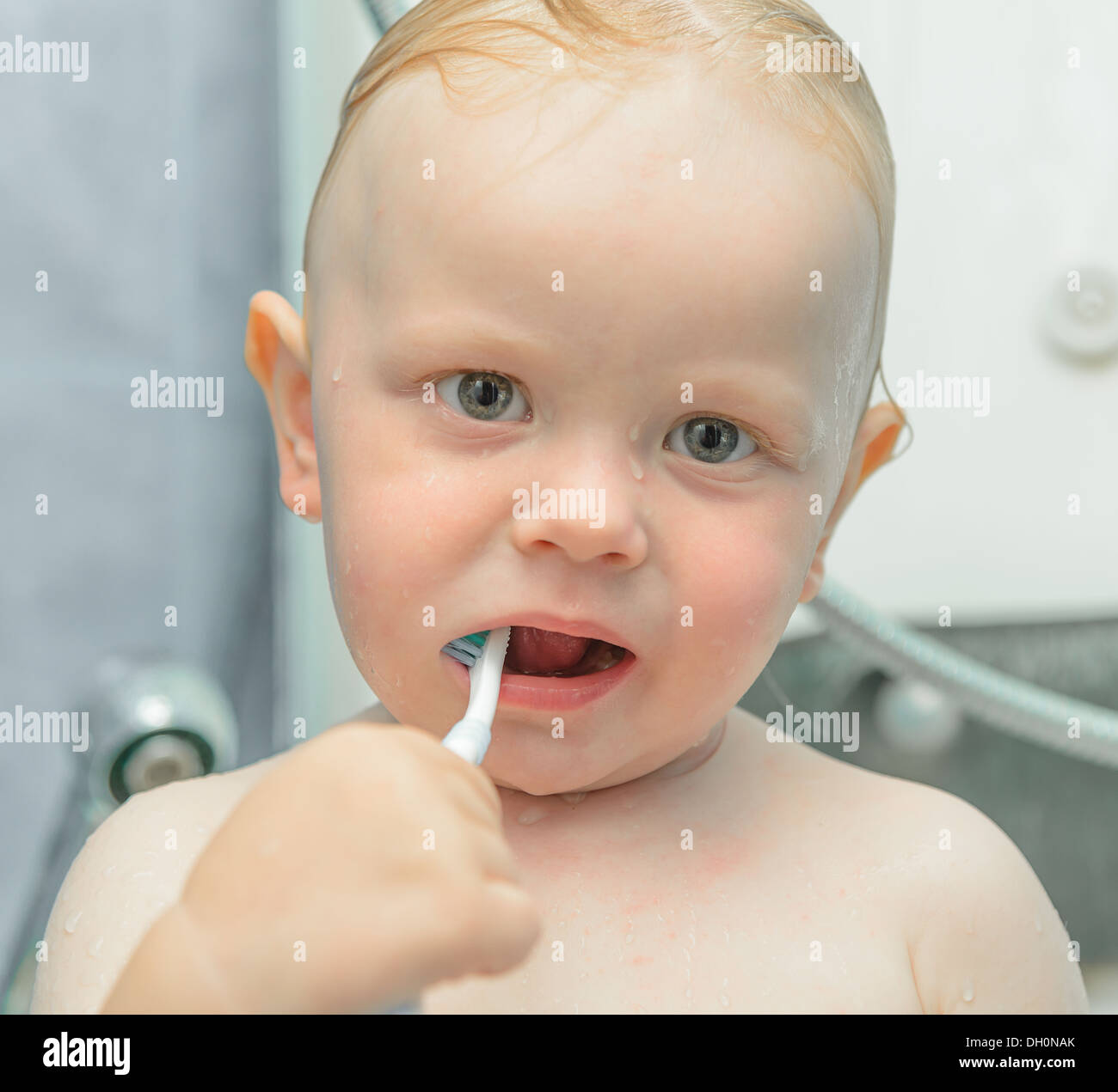 baby boy brushing his teeth Stock Photo - Alamy