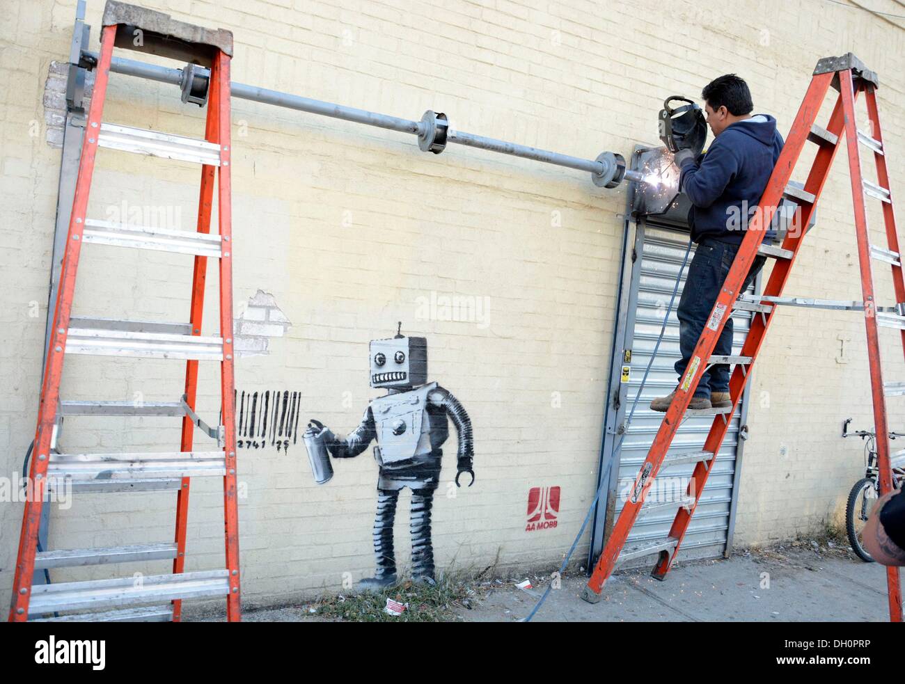 New York, NY, USA. 28th Oct, 2013. Banksy on location for Graffiti Artist Banksy Tags Robot with ...