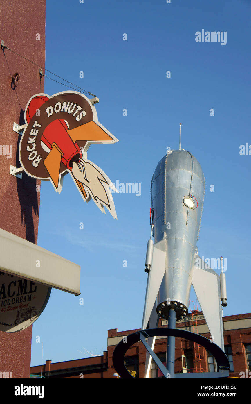 Rocket Donuts sign and metal rocket sculpture and in the city of ...