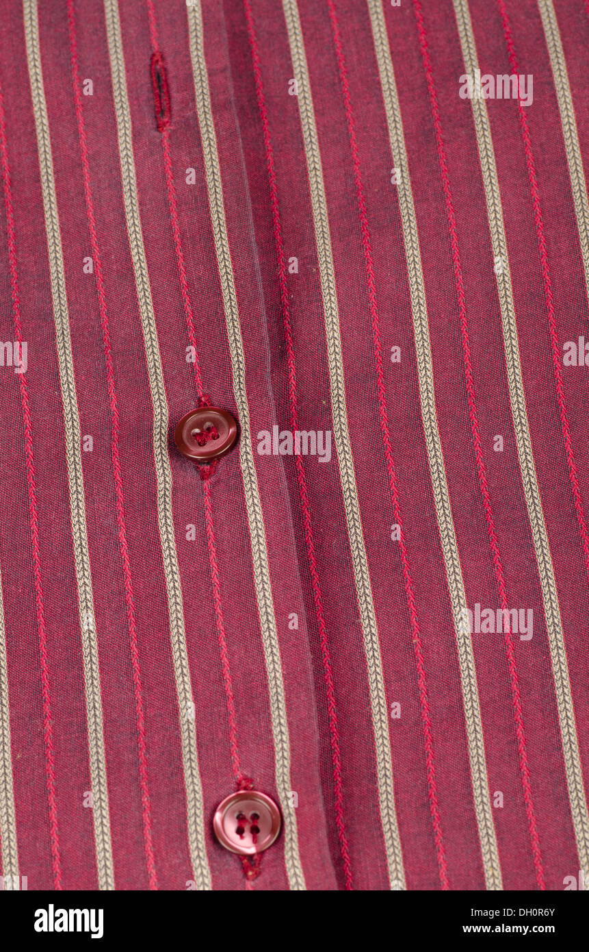 Striped cotton fabric with buttons and buttonholes Stock Photo - Alamy