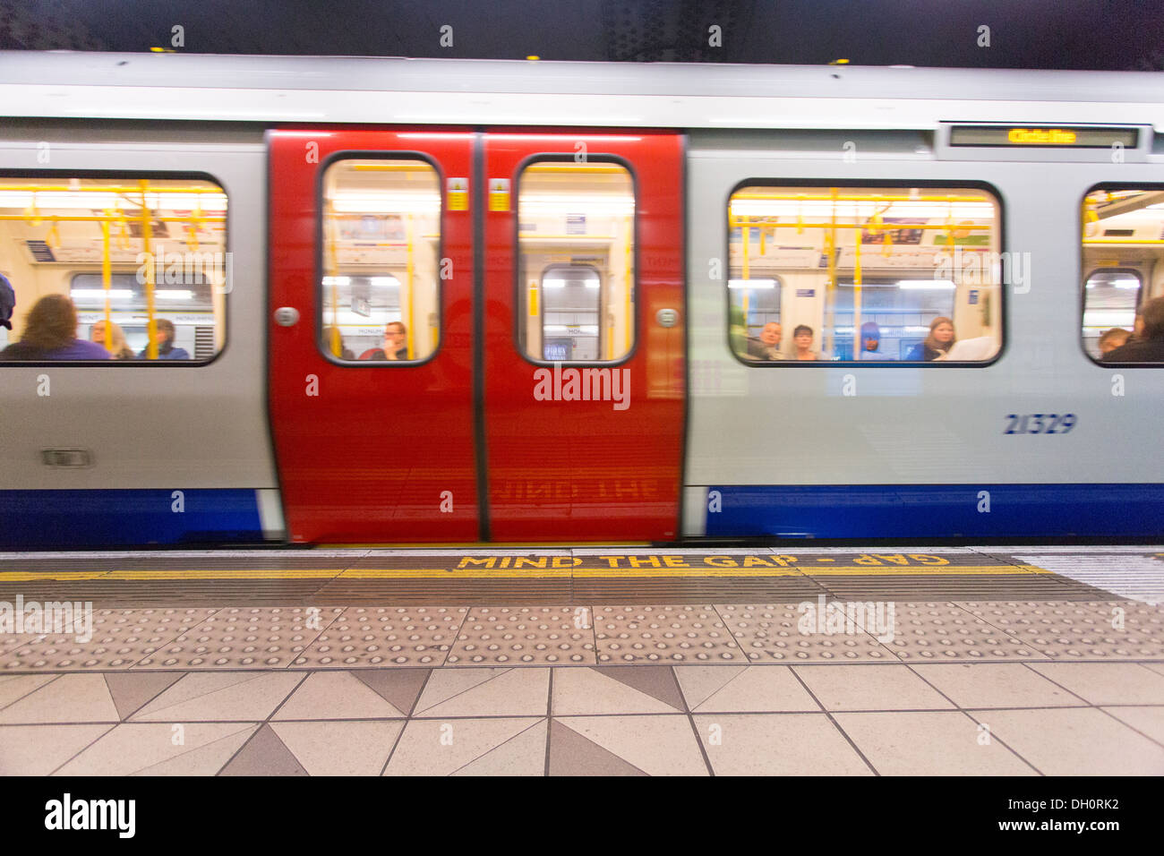 26/10/2013 Mind The Gap. warning sign and London tube train in a ...