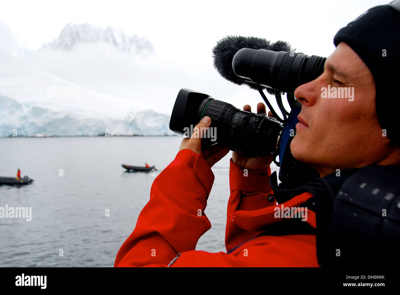 cameraman filming snowy mountains Stock Photo - Alamy