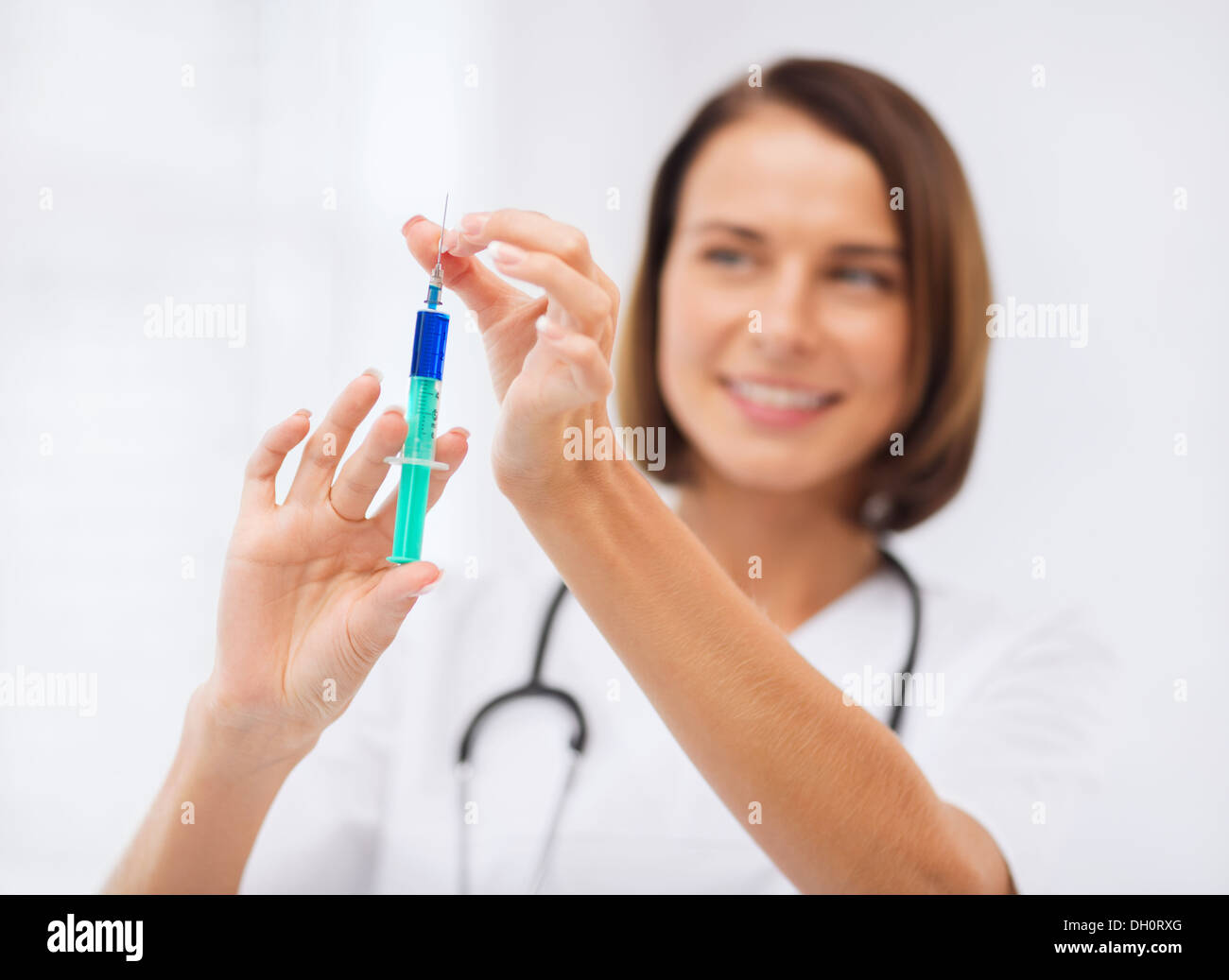 female doctor holding syringe with injection Stock Photo - Alamy