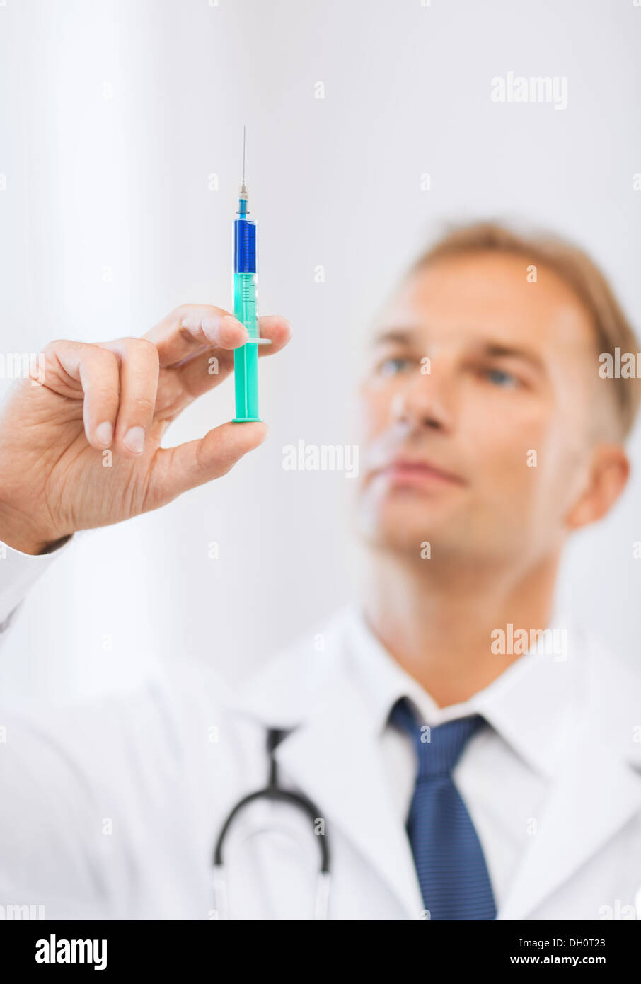 male doctor holding syringe with injection Stock Photo - Alamy