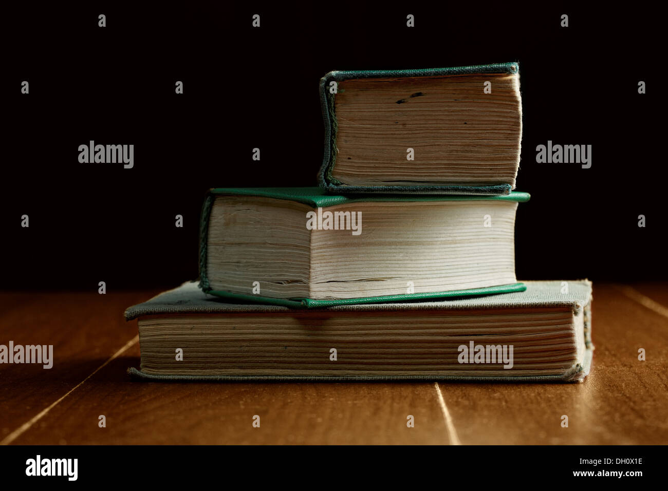 Three old stacked books Stock Photo - Alamy