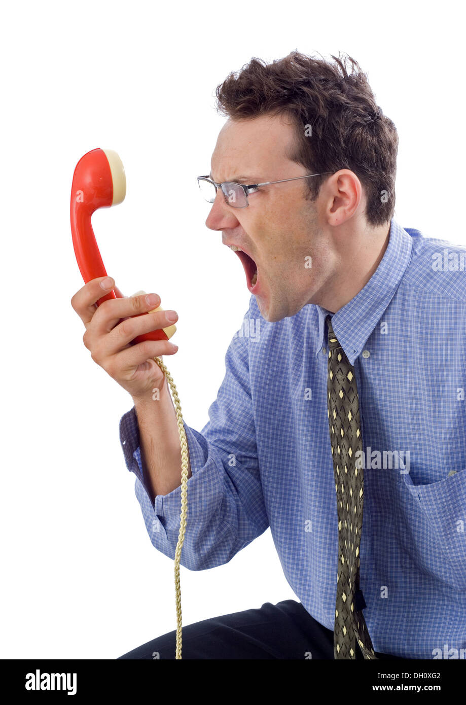 Angry businessman yelling loud in red telephone handset Stock Photo - Alamy