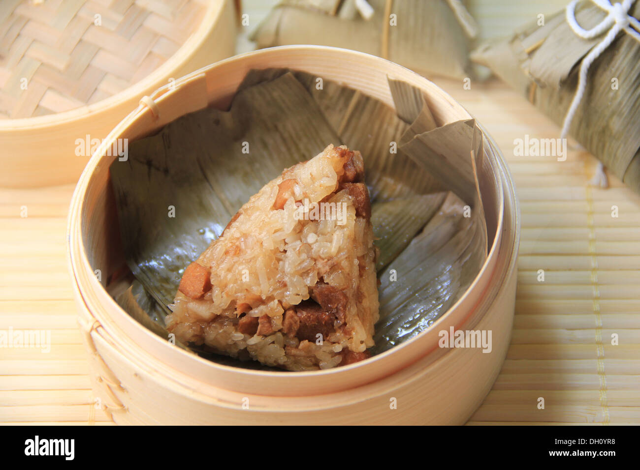 Rice dumpling wrapped in bamboo leaves hi-res stock photography and ...