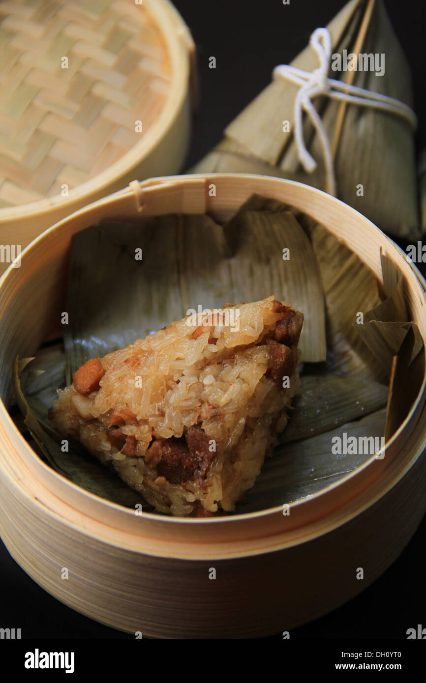 Rice dumpling wrapped in bamboo leaves hi-res stock photography and ...