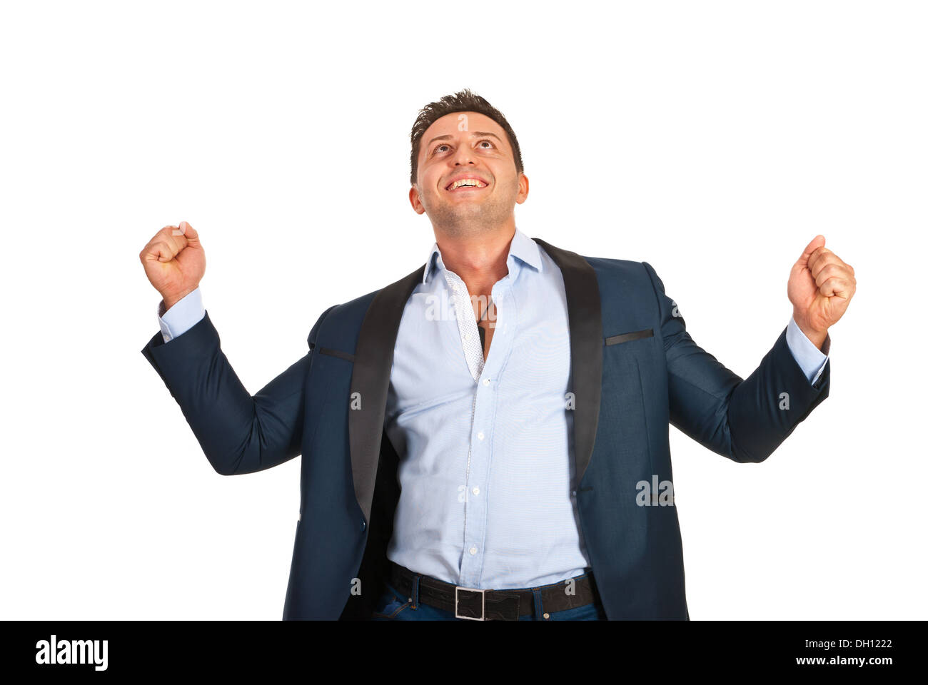 Successful business man cheering and raising hands isolated on white ...