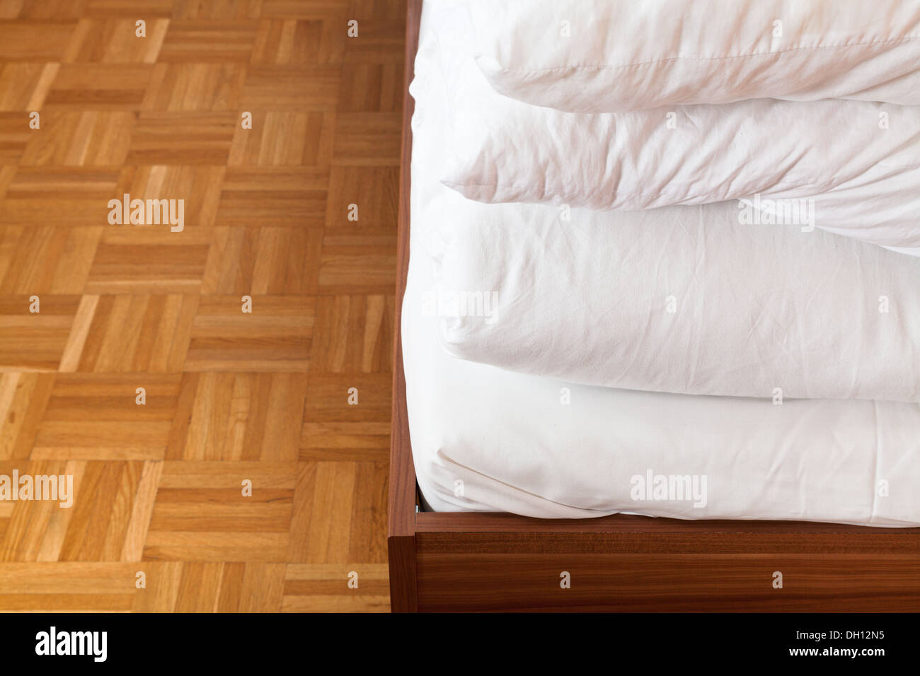 tucked blanket and bed sheet in double bed close up Stock Photo - Alamy