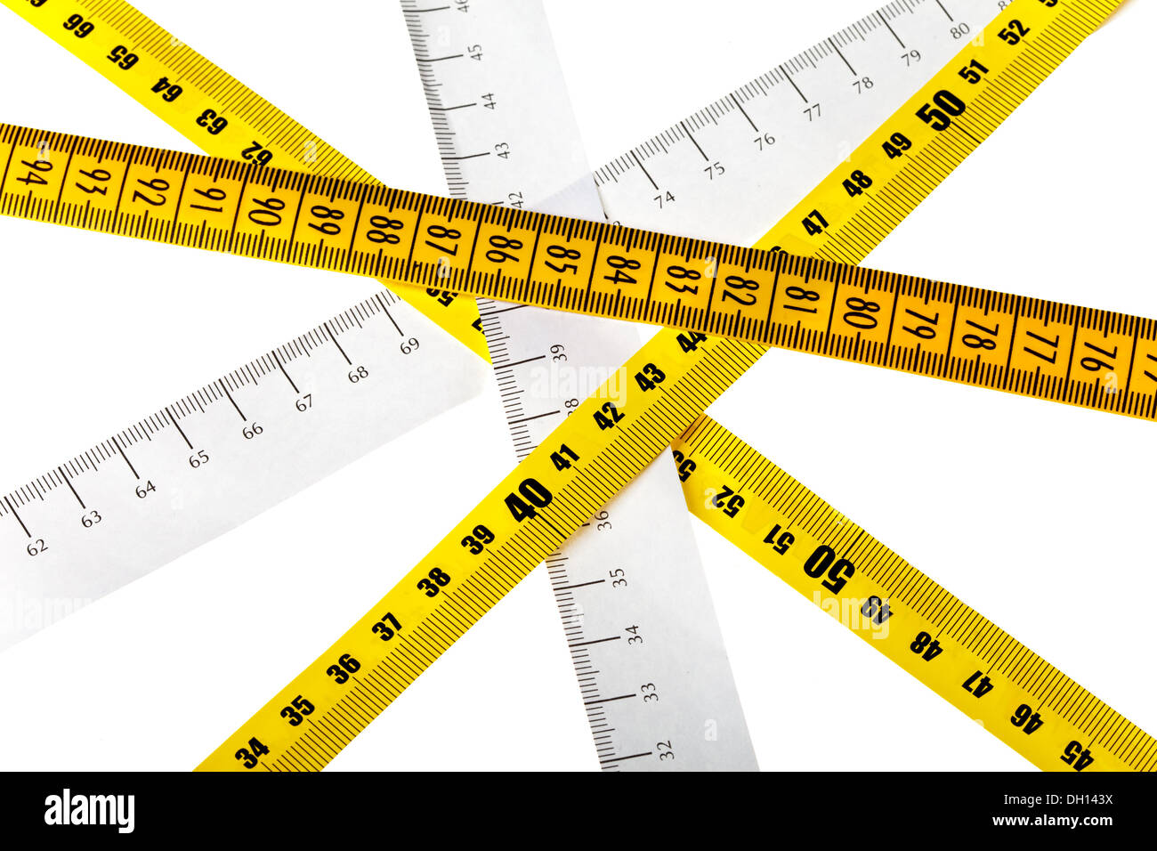 tape measures cross on white background Stock Photo - Alamy
