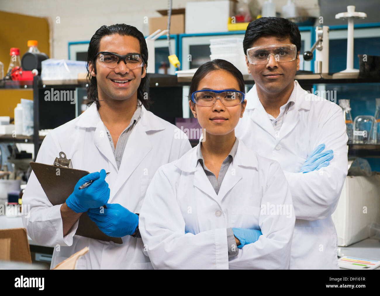 Scientists smiling in laboratory Stock Photo - Alamy