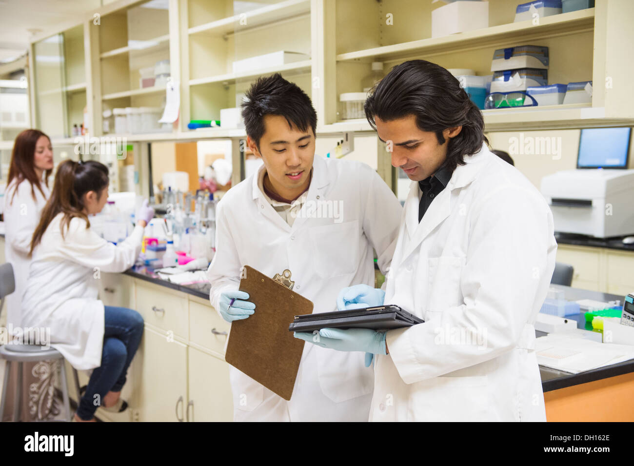 Tablet happy scientists in hi-res stock photography and images - Alamy
