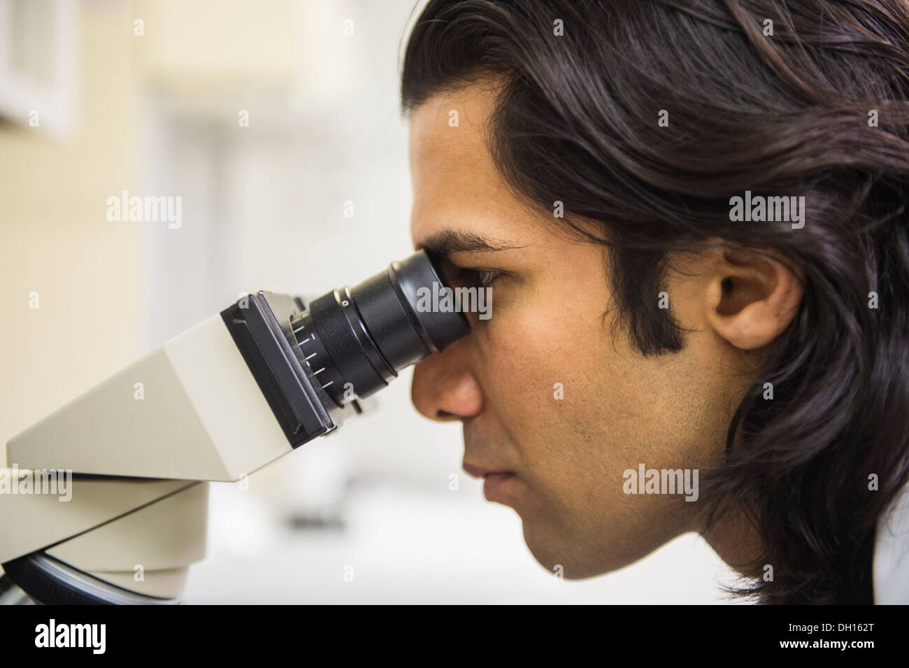 Side profile of an Indian young man looking up Stock Photo - Alamy