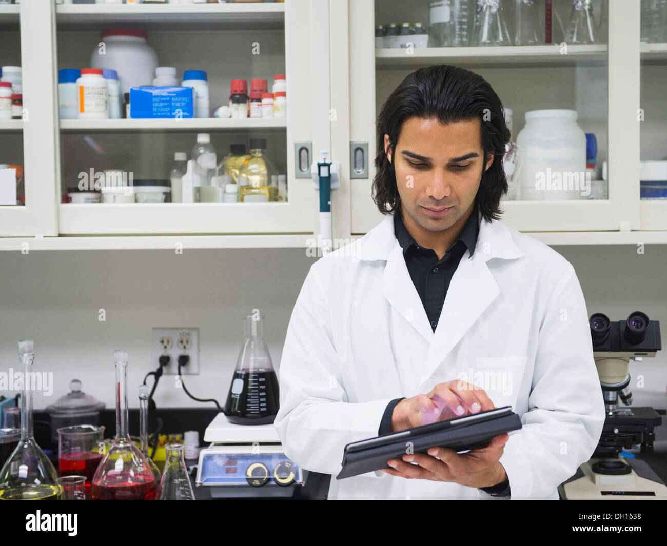 Scientist looking liquid in laboratory hi-res stock photography and ...