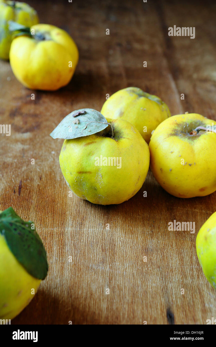 fresh quince on an old table, food Stock Photo - Alamy
