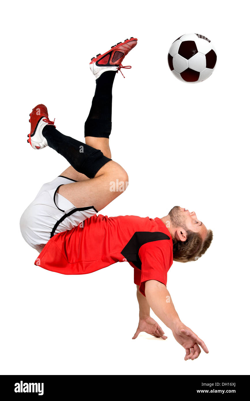 Football player kicking a ball isolated in white Stock Photo - Alamy