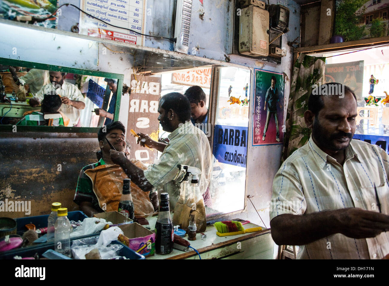 A local barber performs a wet shave on a happy customer, Barber Shop ... A local barber performs a wet shave on a happy customer, Barber Shop ...