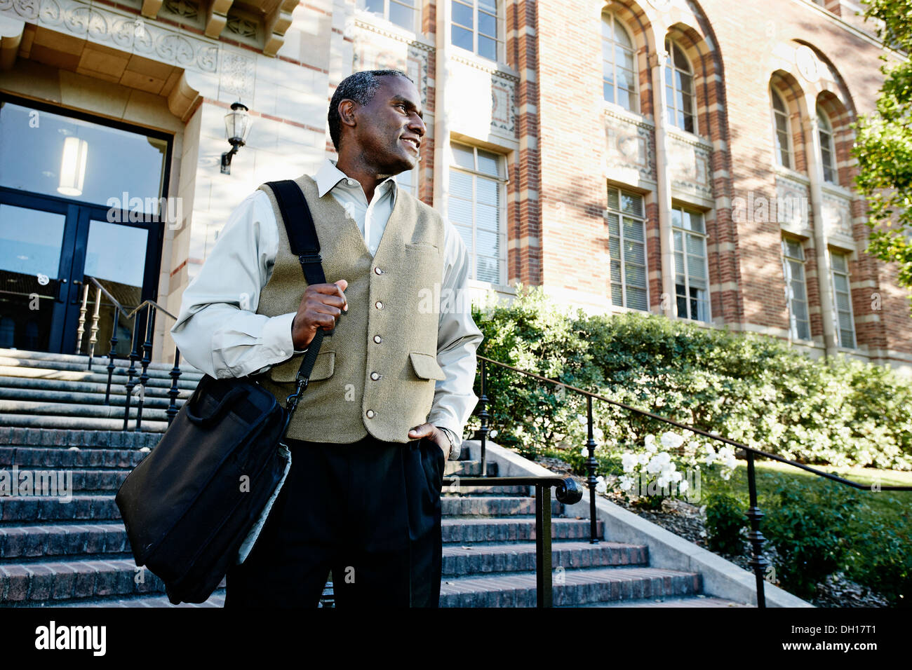 African American professor walking on campus Stock Photo - Alamy