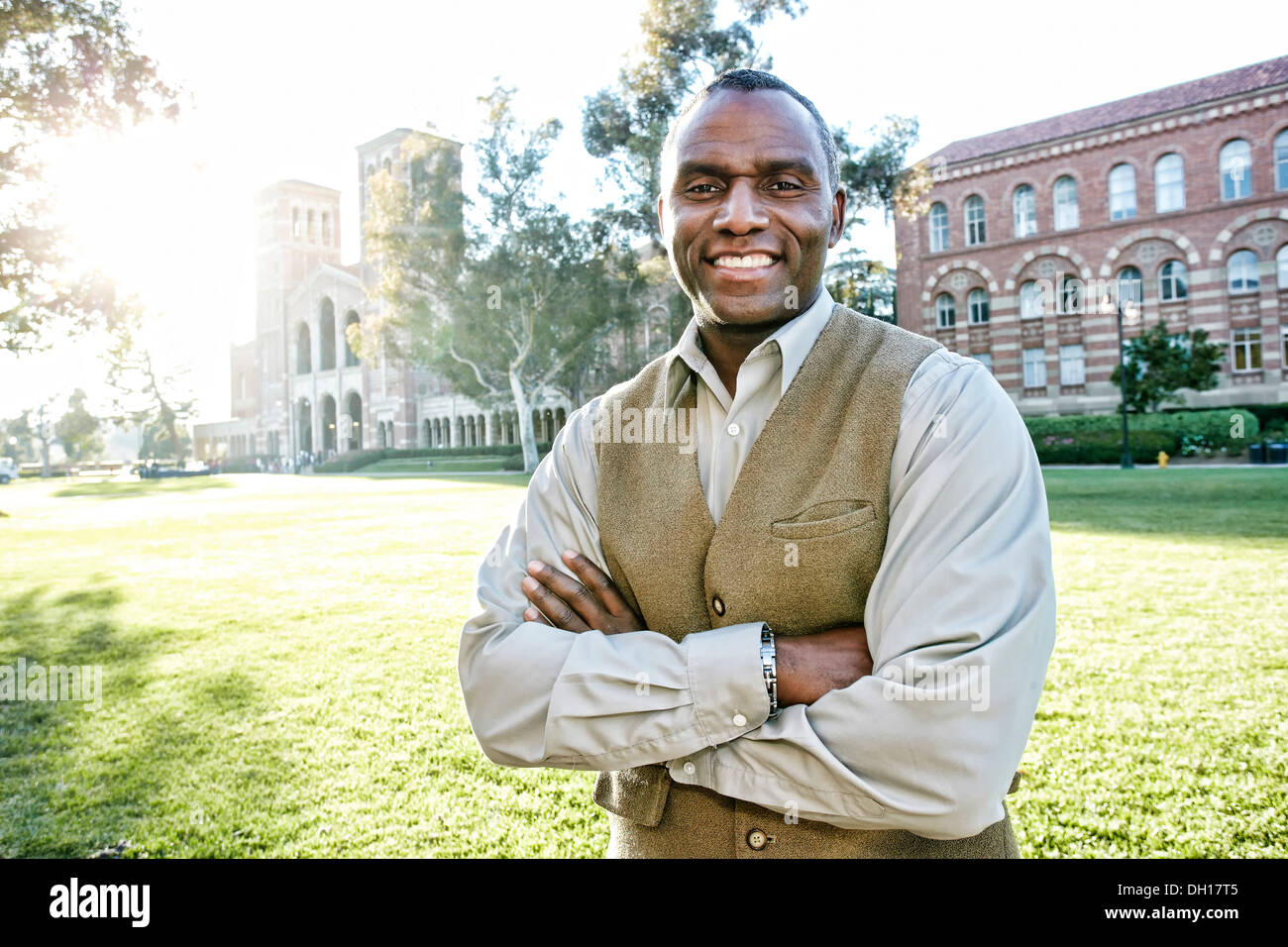 African American professor smiling on campus Stock Photo - Alamy