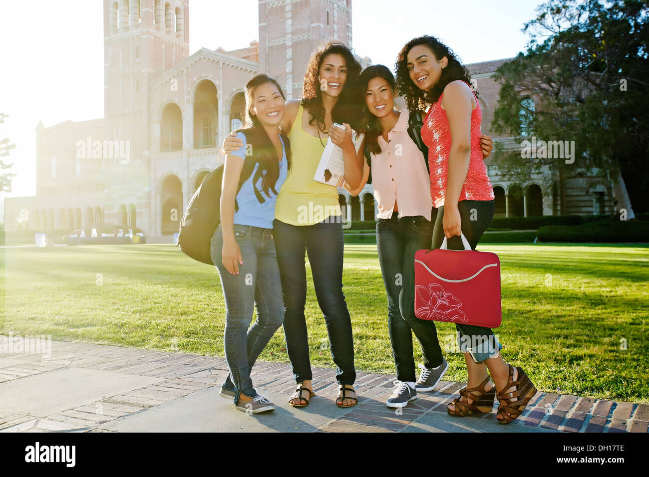 Students smiling together on campus Stock Photo - Alamy