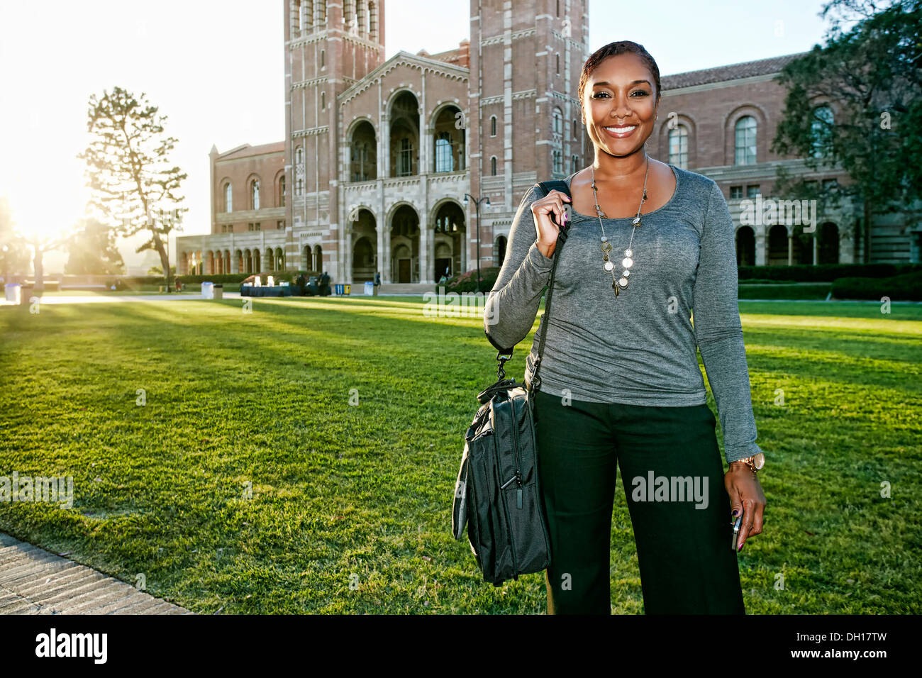 African American professor smiling on campus Stock Photo - Alamy